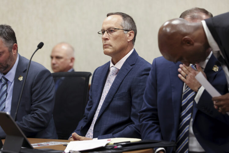 Judge throws out murder charge against Michigan officer who struck a ...